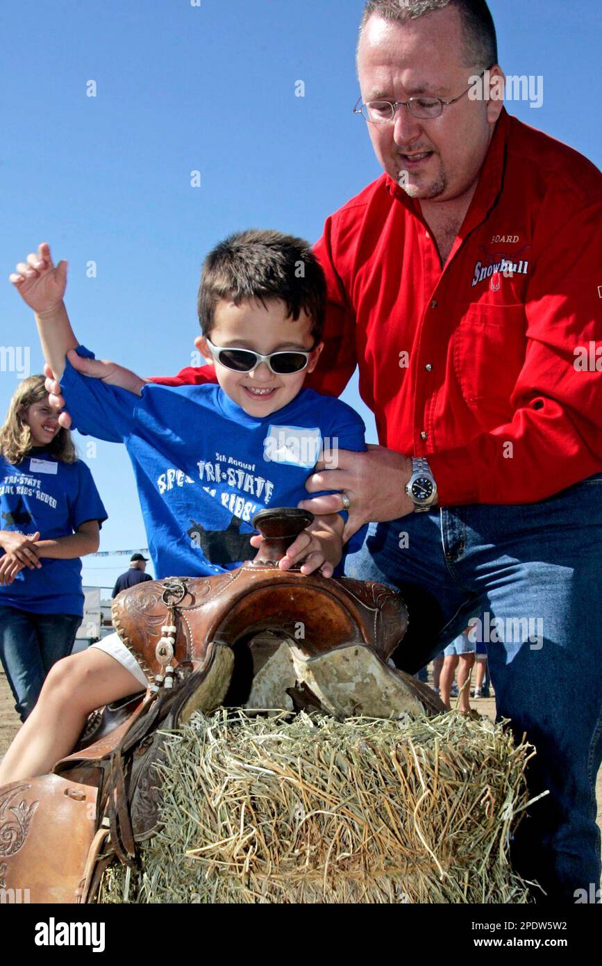 Blake Rascon, 4, Fort Madison, Iowa, rides a hay bail horse with the ...