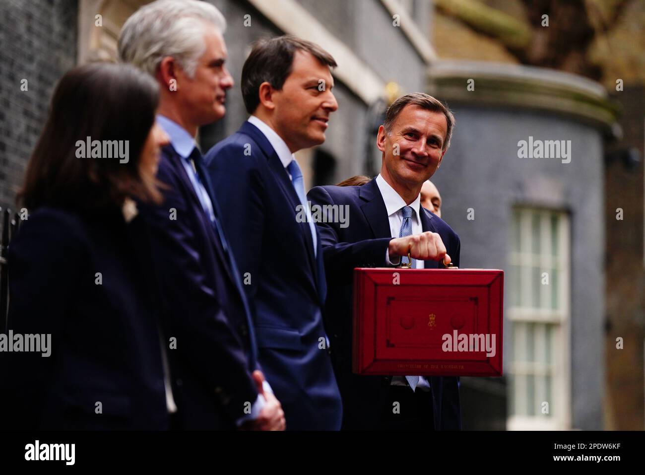 Chancellor of the Exchequer Jeremy Hunt holds up his ministerial box as ...
