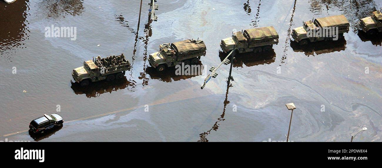 A U.S. Military convoy drives through floodwaters from Hurricane ...