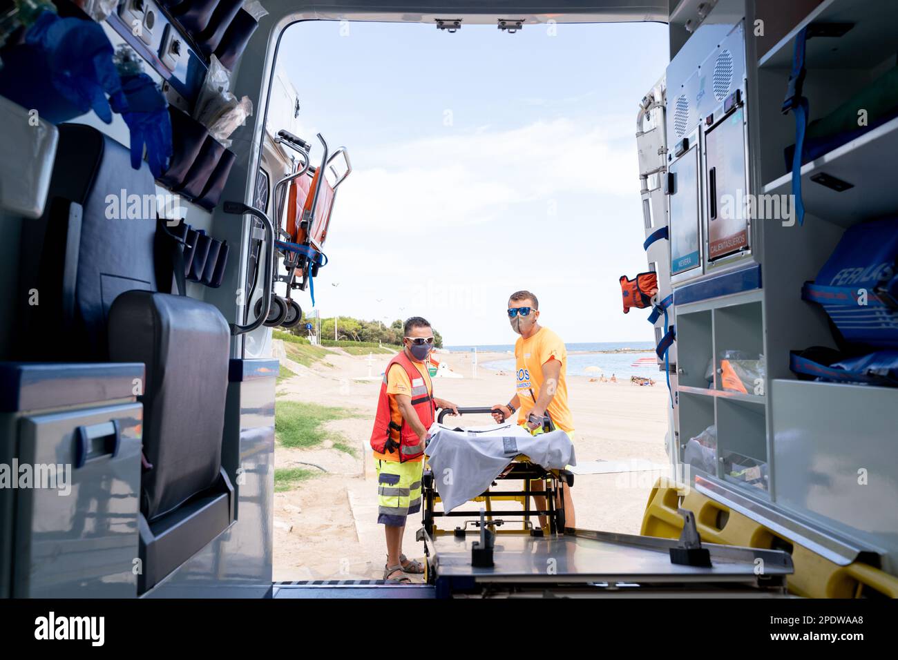 Views from inside an ambulance of a team of First aid working on the ...