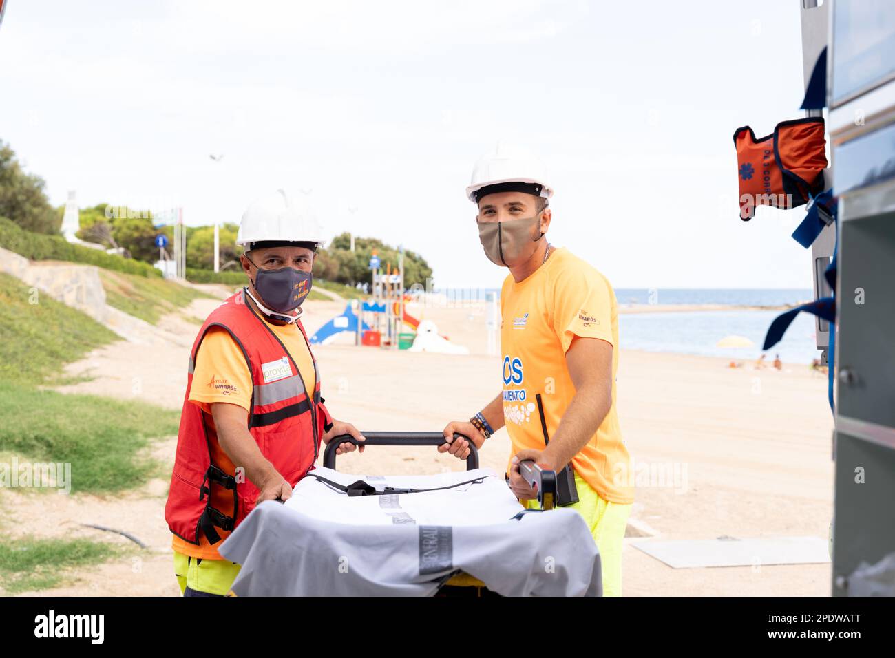 First aid staff working on the beach using a stretcher from an ...