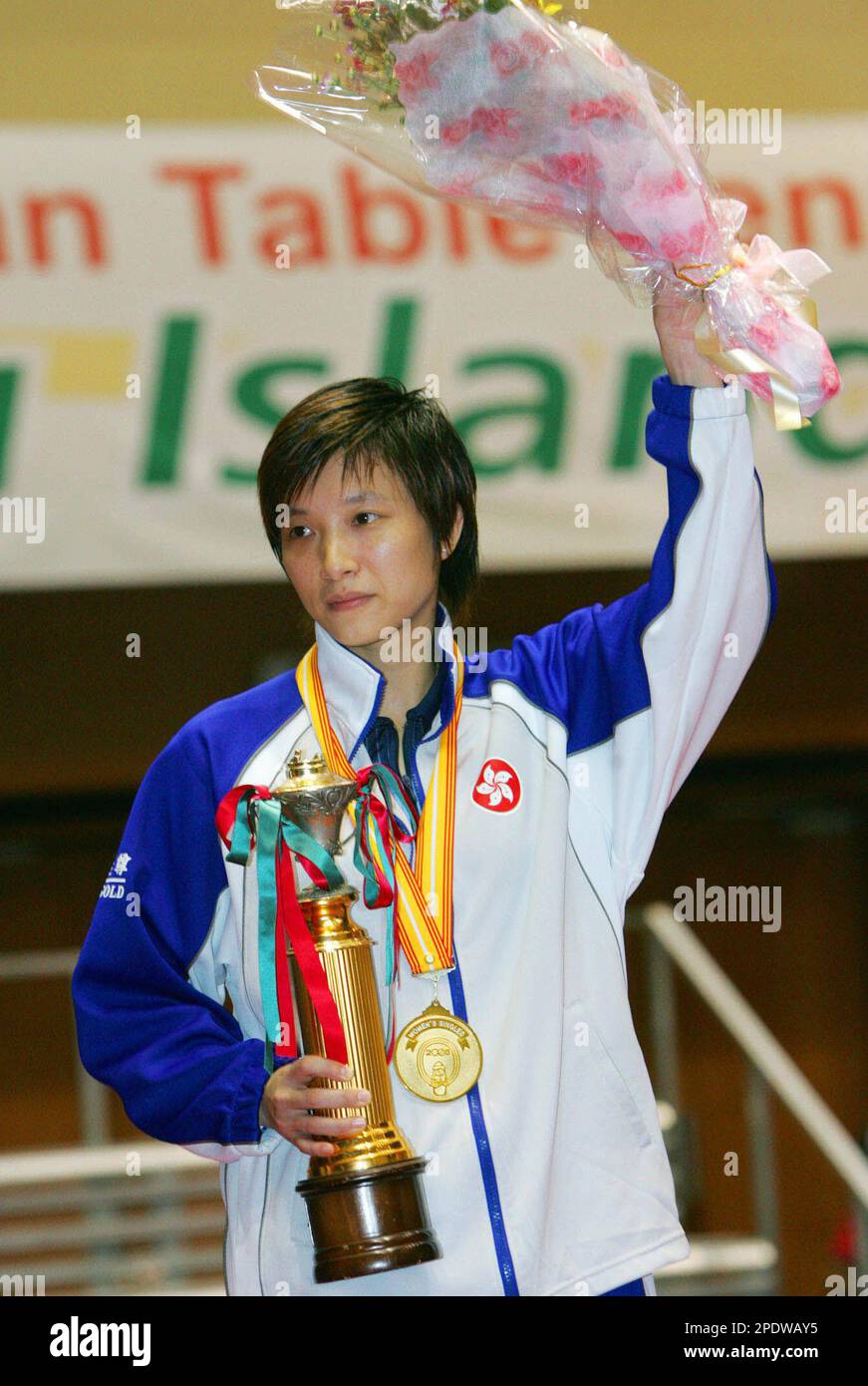 Hong Kong's Lin Ning with the trophy waves flowers after winning the ...