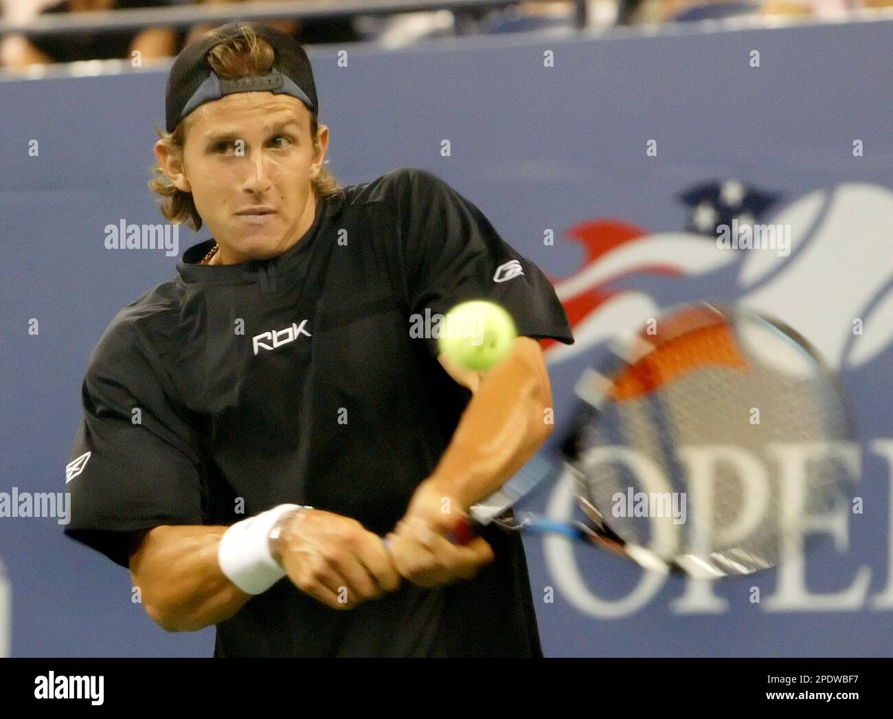 Igor Andreev, of Russia, hits a return to James Blake, of the United ...