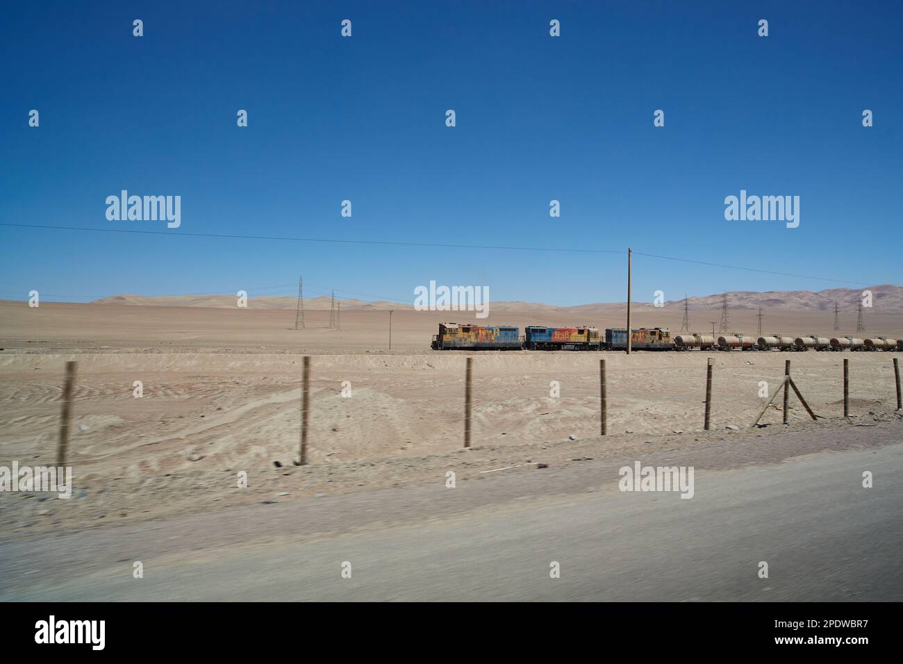 three locomotives pulling gas tank waggons through the Atacama desert ...