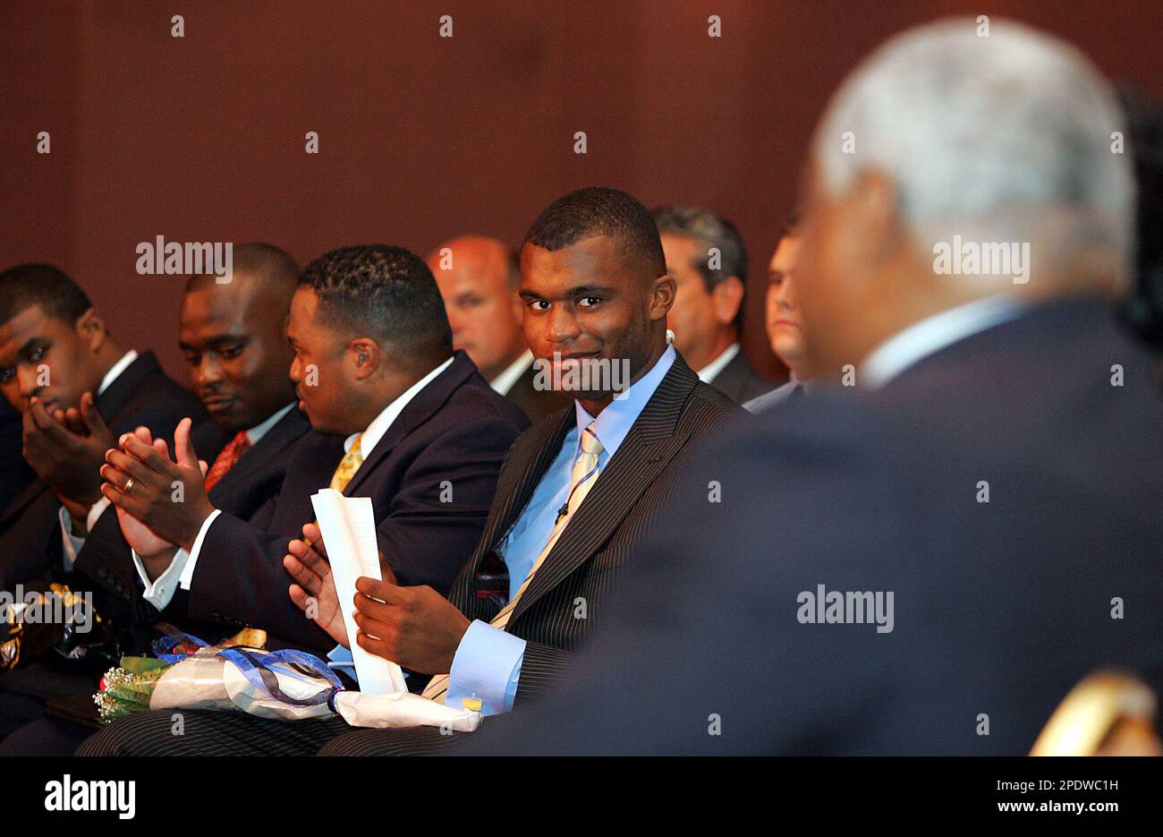 Myron Rolle, center, makes eye contact with his father Whitney Rolle of ...