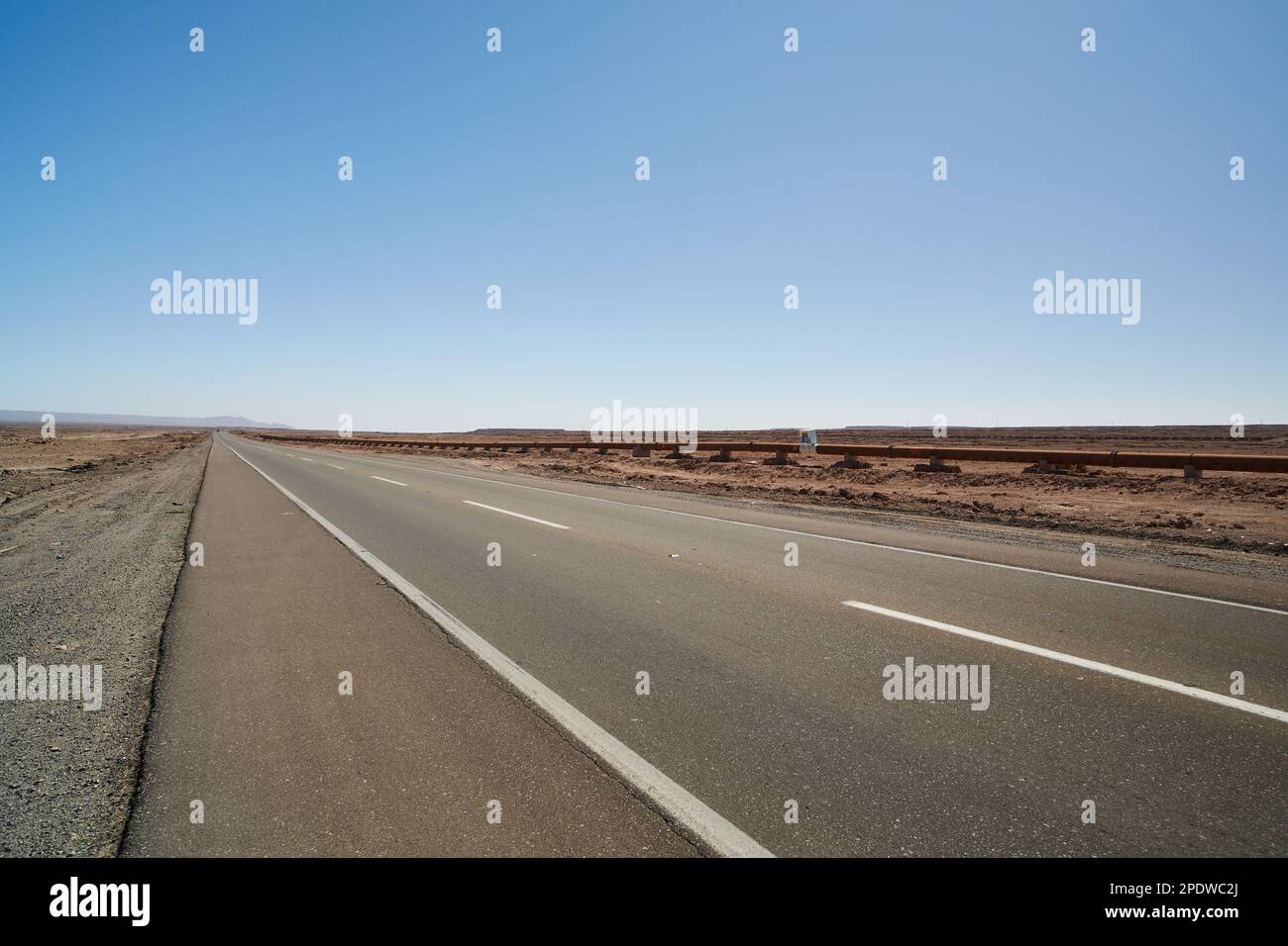 Chile, Atacama desert - long empty straight road through the desert ...