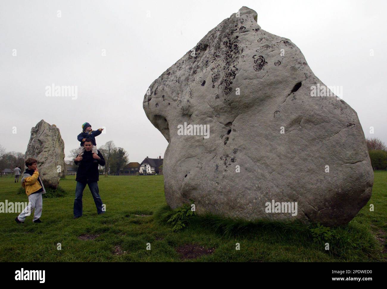 Visitors take a close look at one of the stones that forms the largest ...