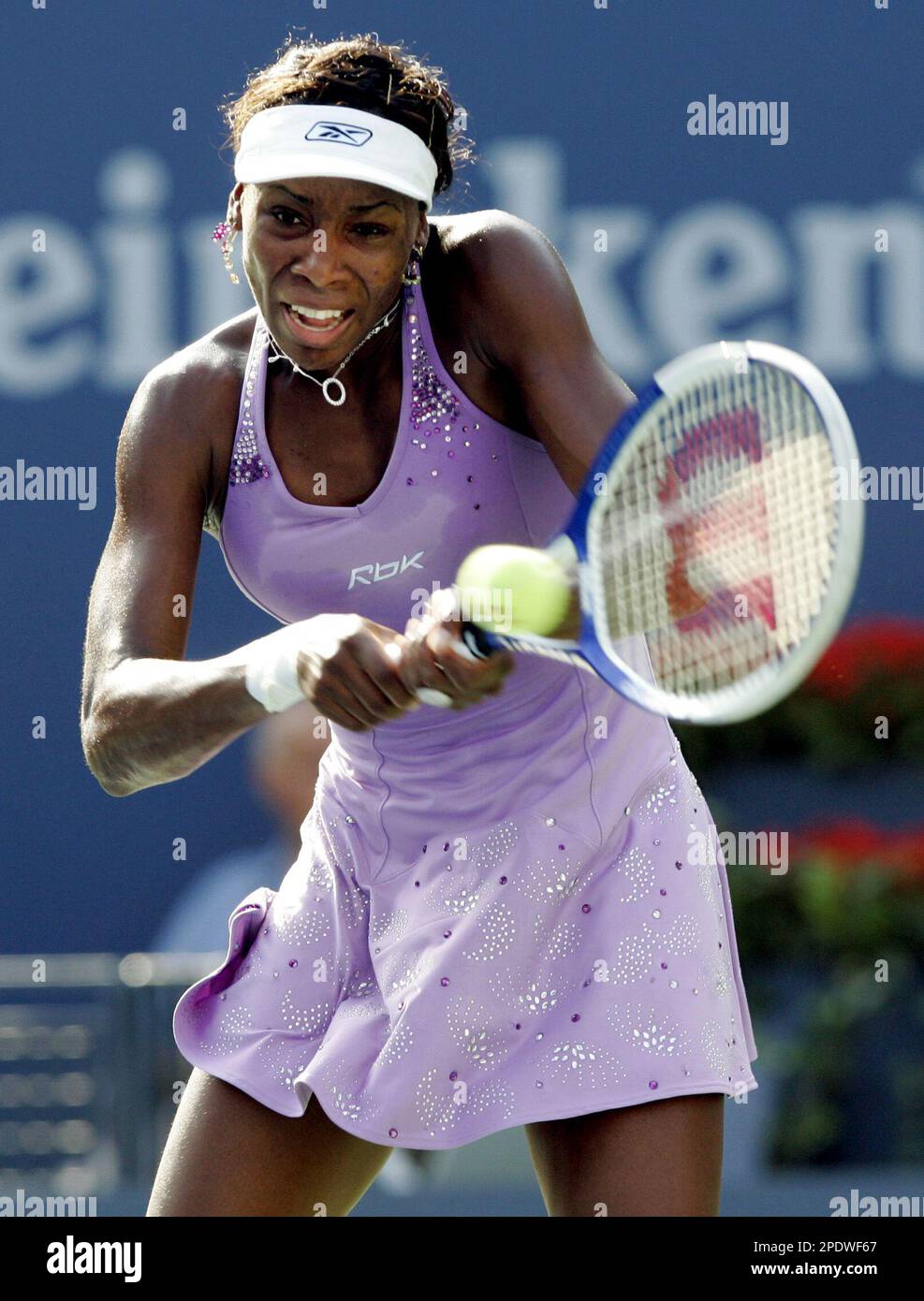 Venus Williams, of the United States, hits a return to Maria Kirilenko ...