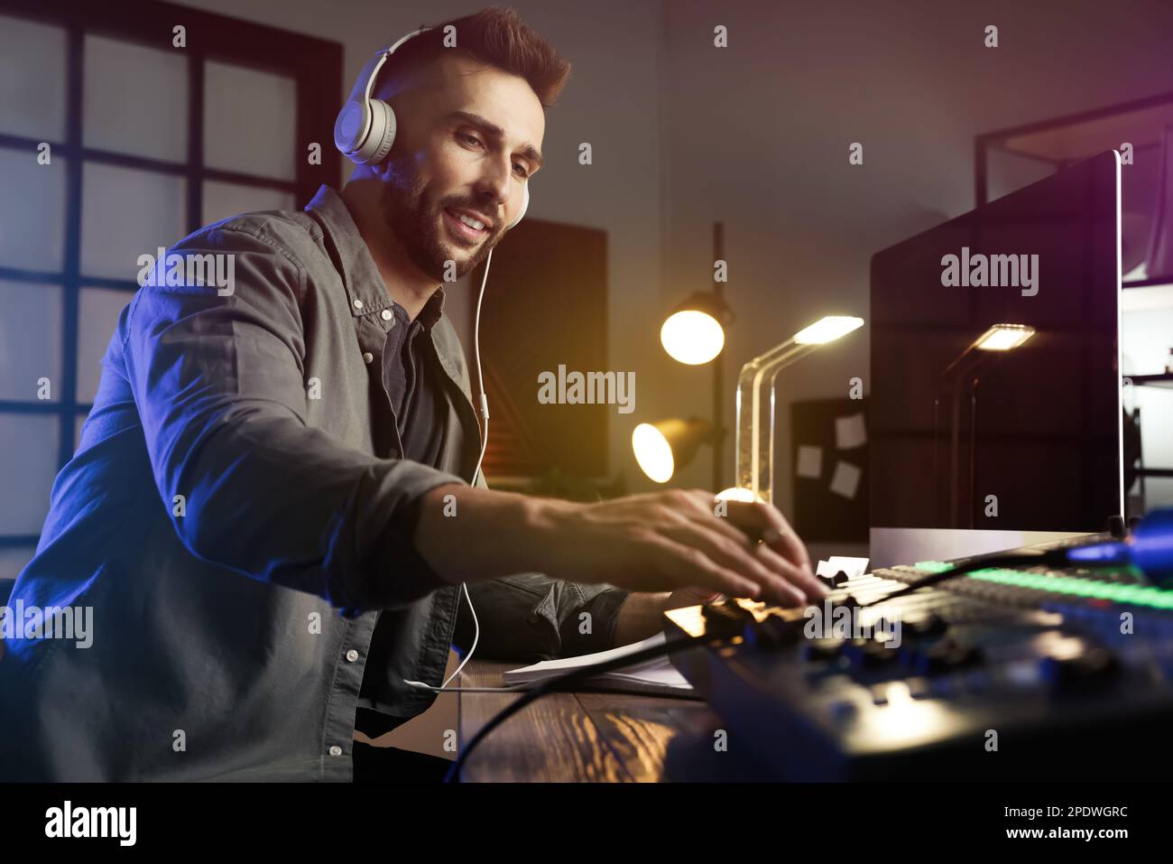 Man working as radio host in modern studio Stock Photo - Alamy