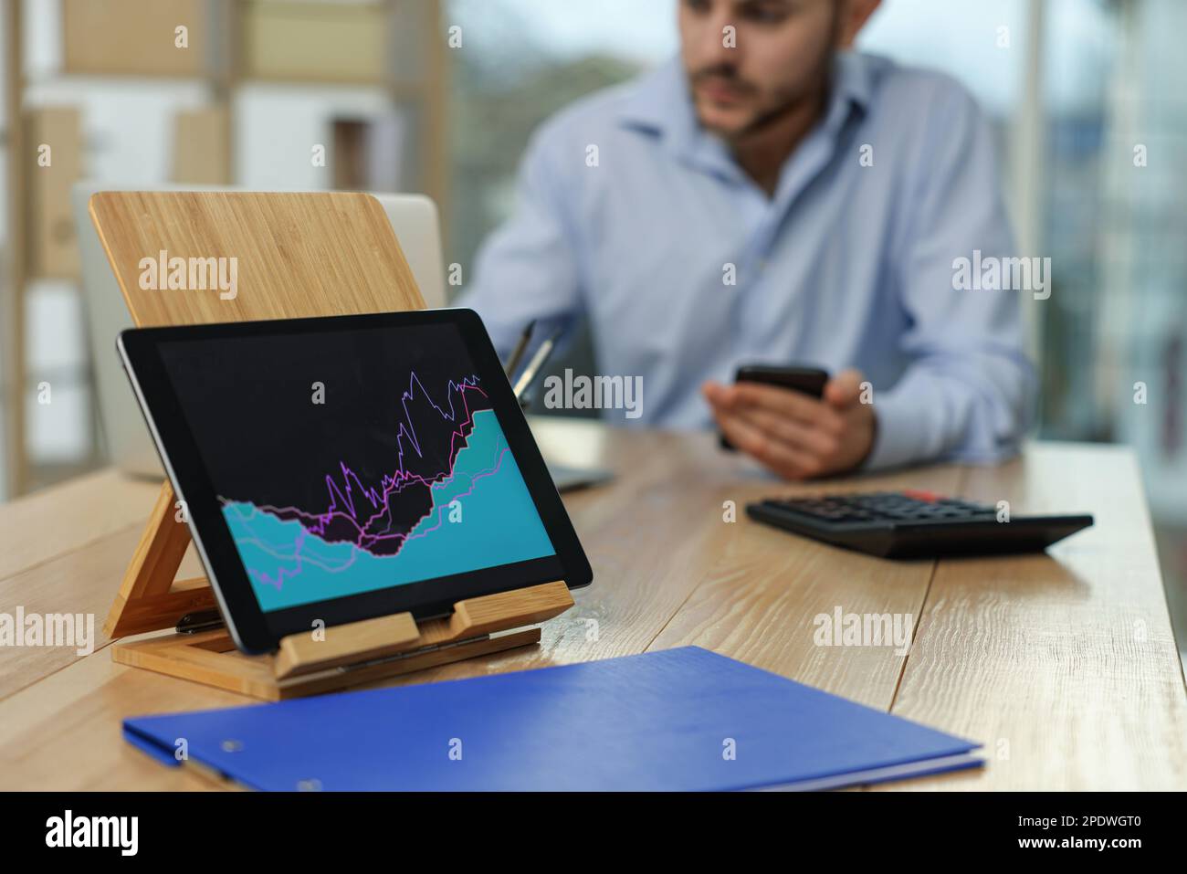 Forex trader working in office, focus on tablet with chart Stock Photo ...