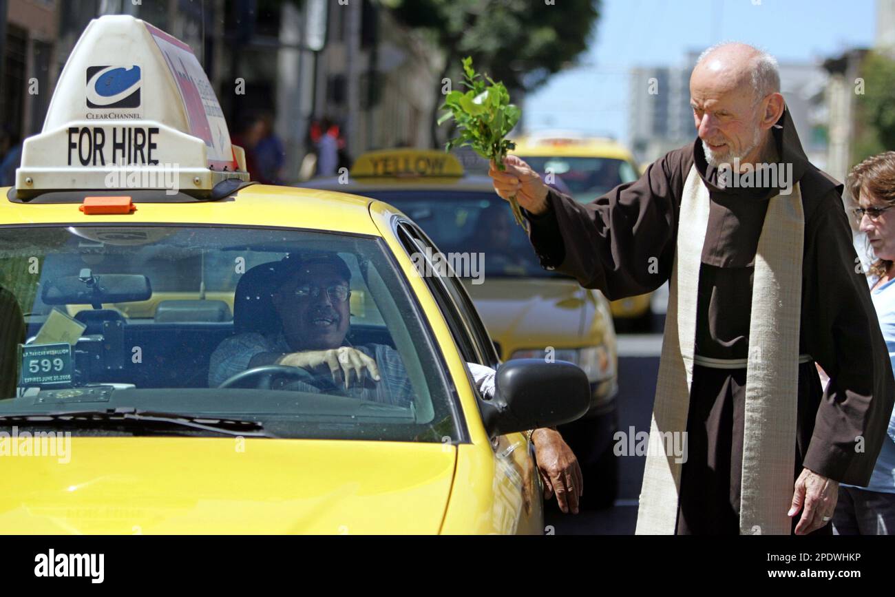 Franciscan friar Father Louis Vitale blesses a taxicab in front of St ...