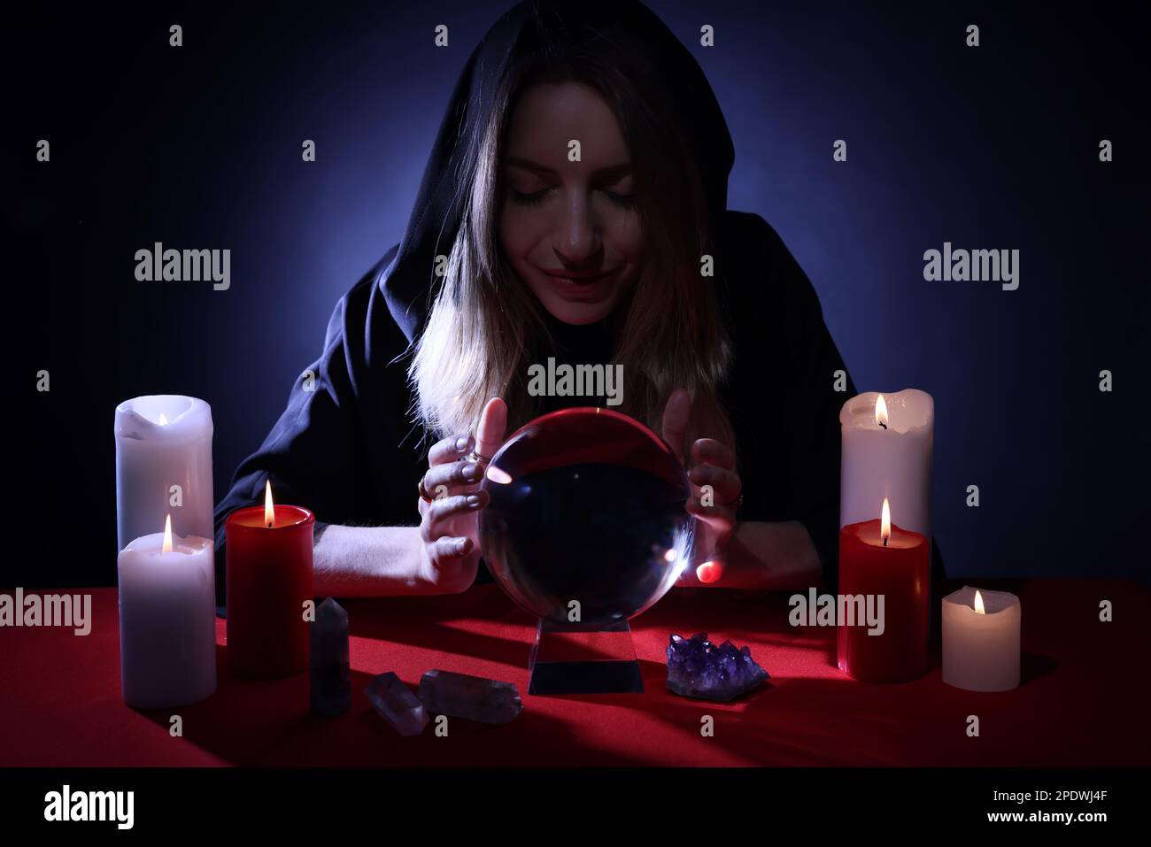 Soothsayer using crystal ball to predict future at table in darkness ... Soothsayer using crystal ball to predict future at table in darkness ...