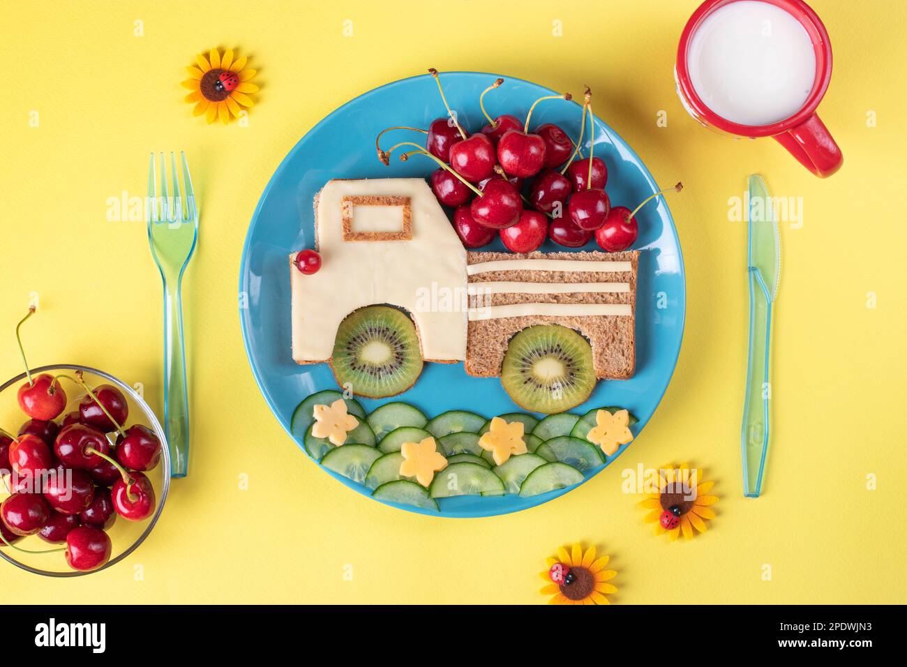 Healthy toast for kids in shape of car with cherry, kiwi, cucumber and ...