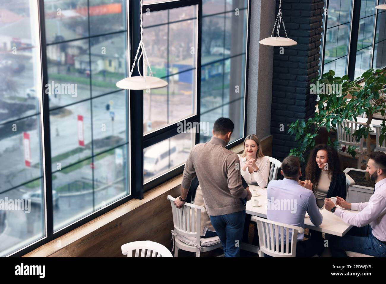 Group of coworkers having coffee break in cafe, space for text Stock ...