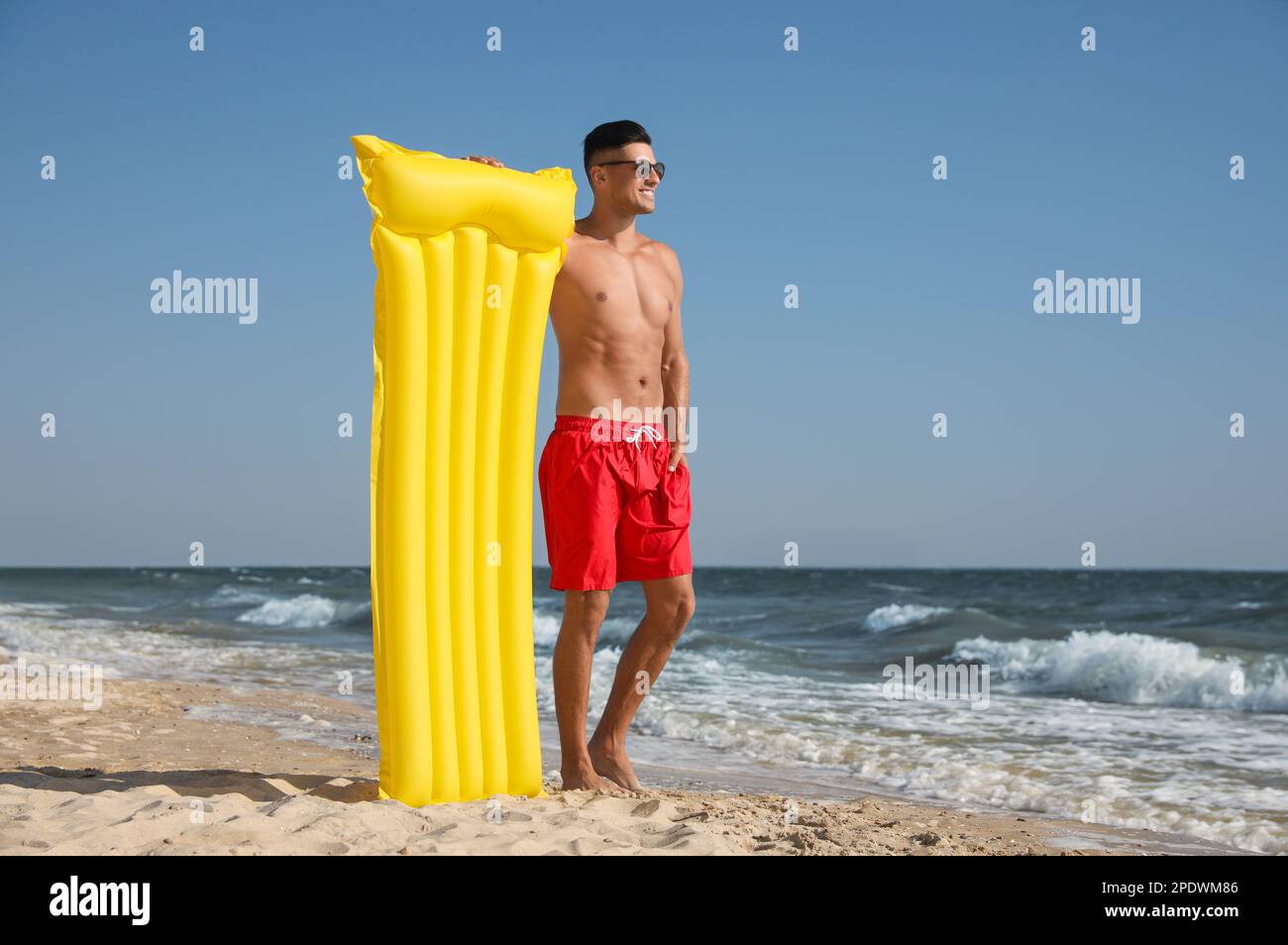 Man swimming yellow inflatable mattress hi-res stock photography and ...