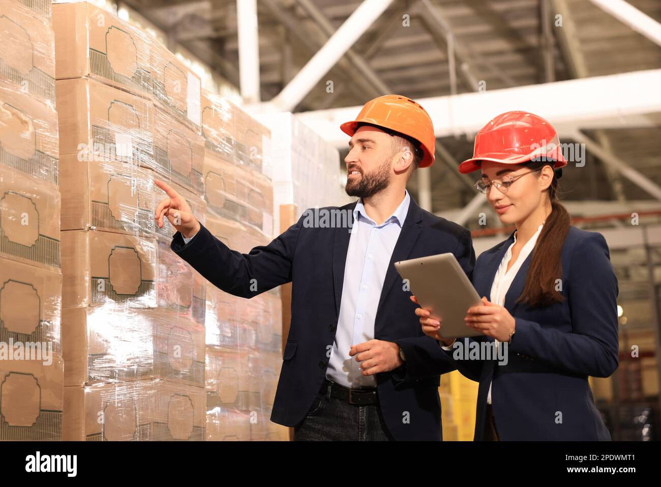 Manager and supervisor at warehouse. Logistics center Stock Photo - Alamy