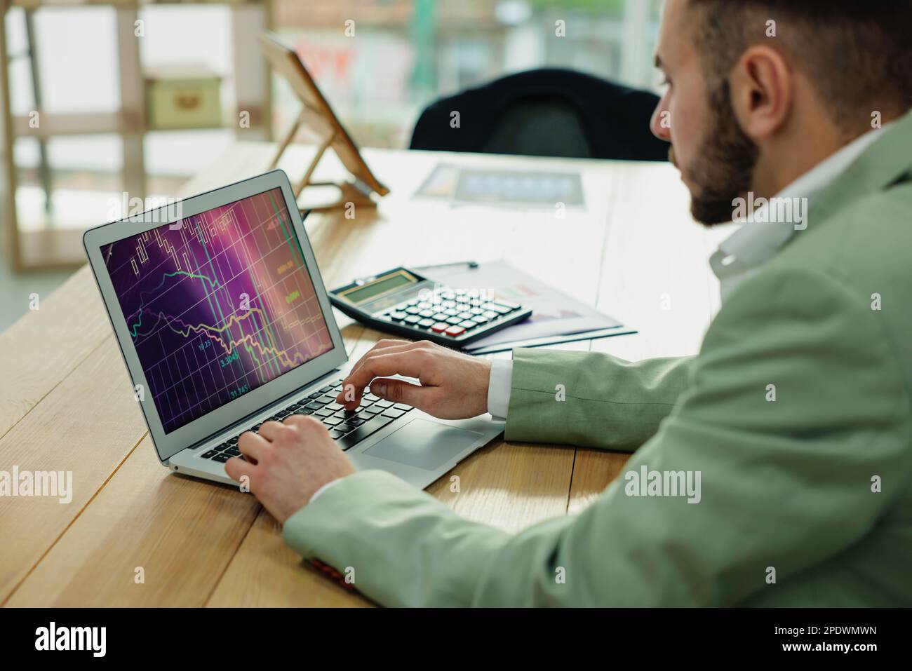 Forex trader working with laptop in office Stock Photo - Alamy