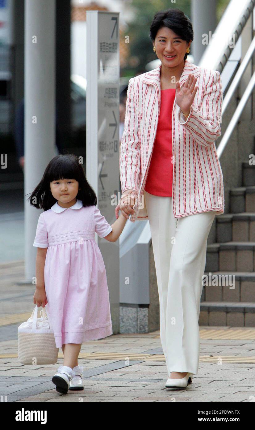 Japan's Crown Princess Masako holds the hand of her daughter, Princess ...
