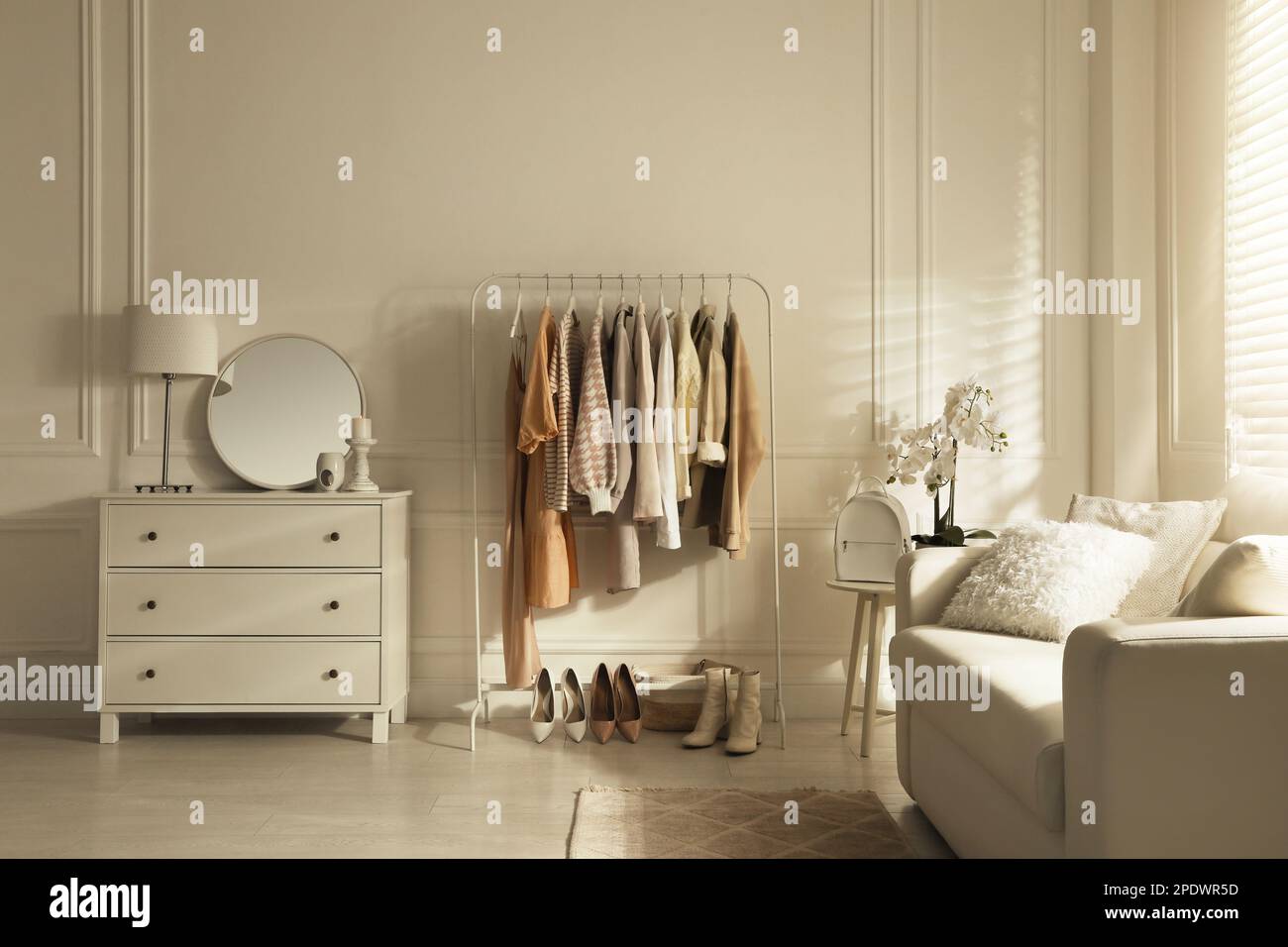 Modern dressing room interior with stylish clothes, shoes and beautiful ...