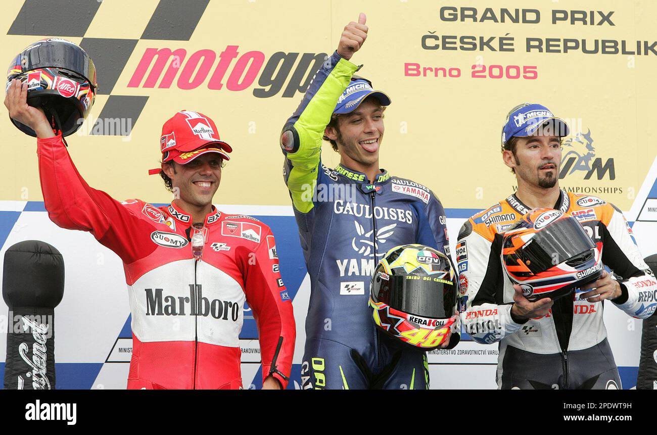 Yamaha MotoGP rider Valentino Rossi, center, Ducati rider Loris ...