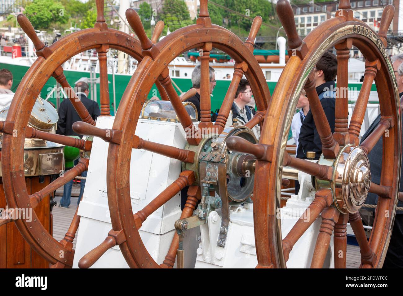 Several wheels in a boat, with additional wheels in the background ...