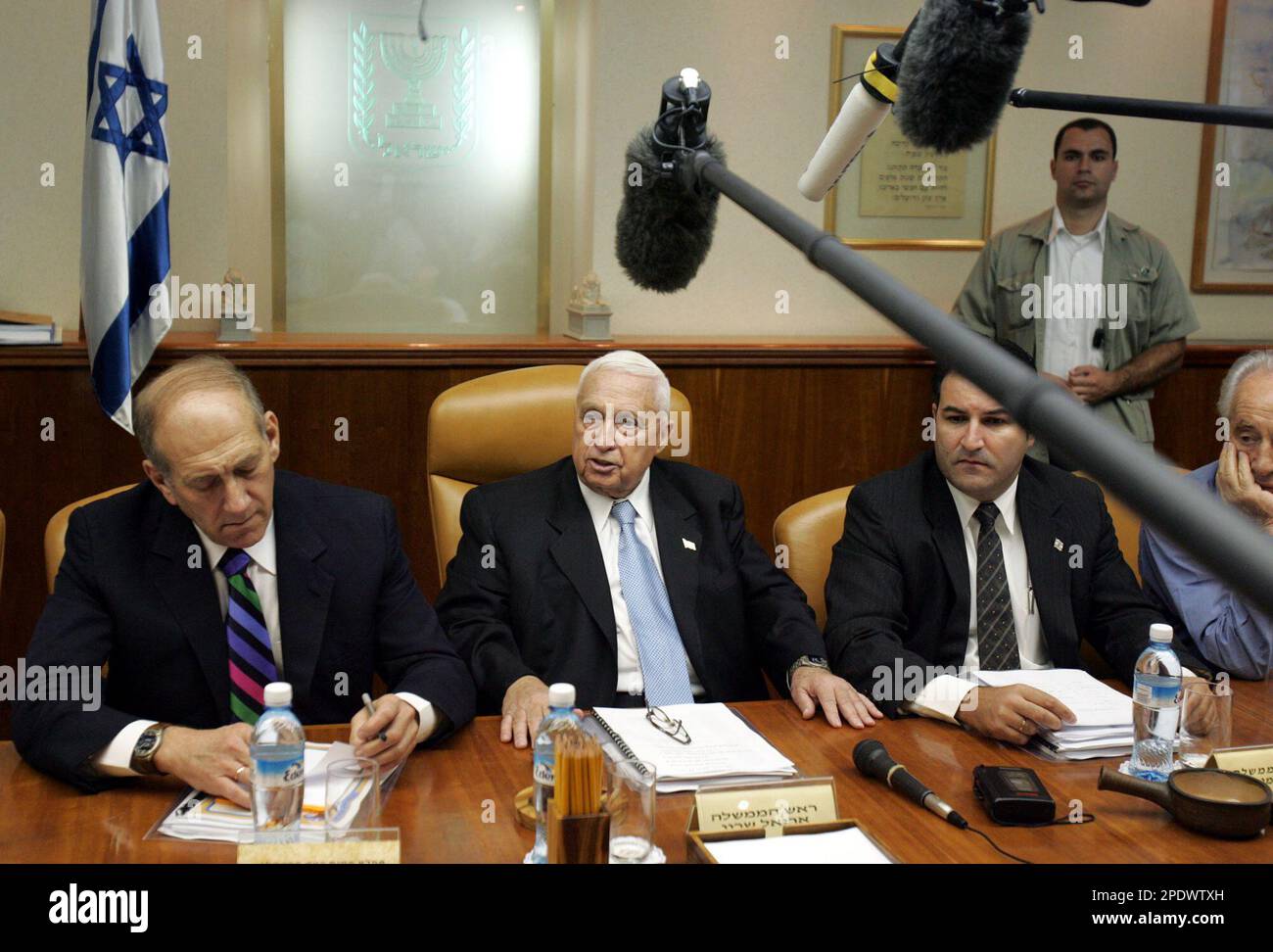 Israel's Prime Minsister Ariel Sharon, center, attends the weekly ...