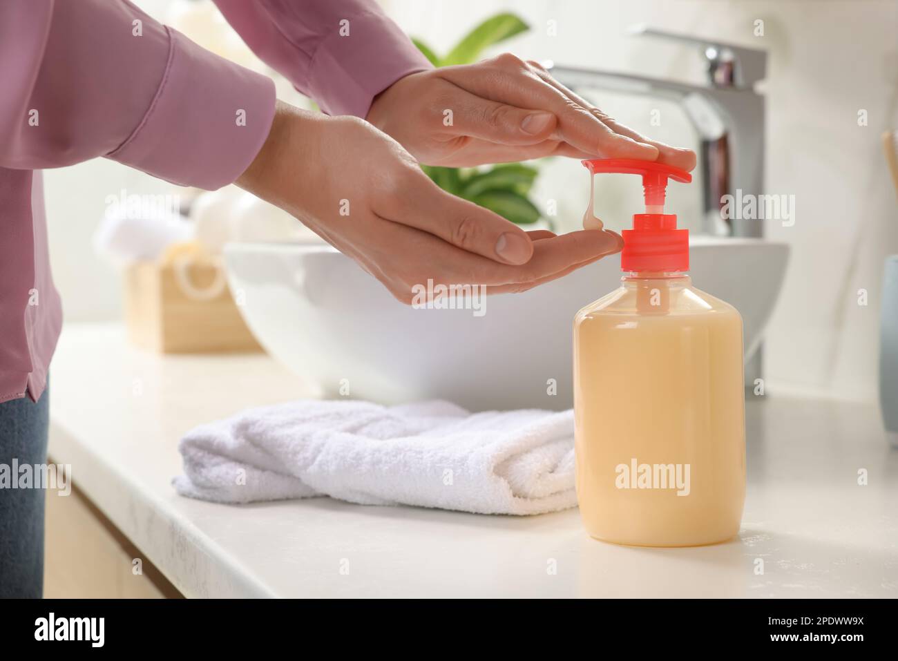 Woman using shower gel hi-res stock photography and images - Alamy