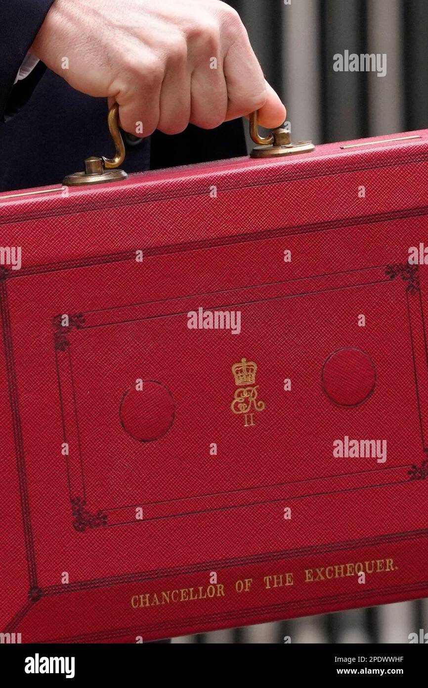 Britain's Chancellor of the Exchequer Jeremy Hunt holding his ...