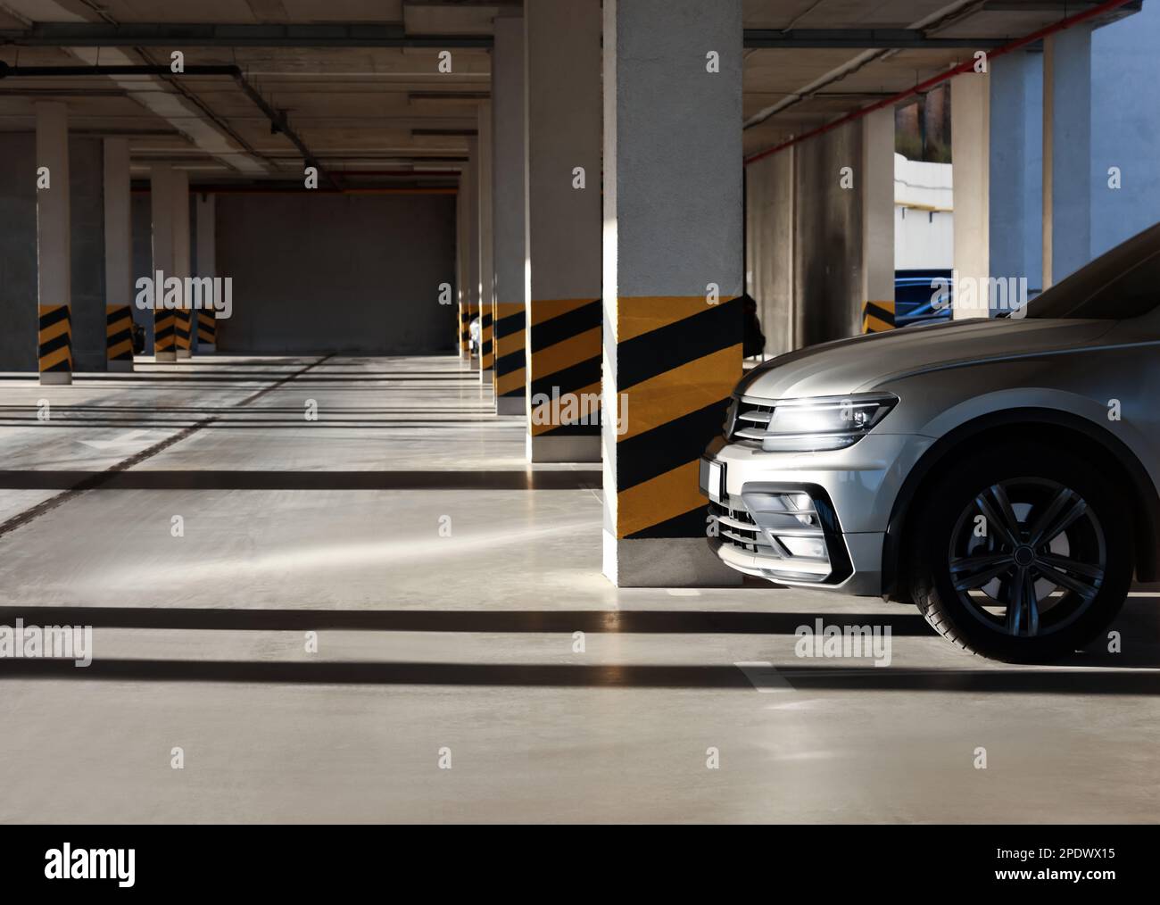 Open parking garage with car on sunny day Stock Photo - Alamy