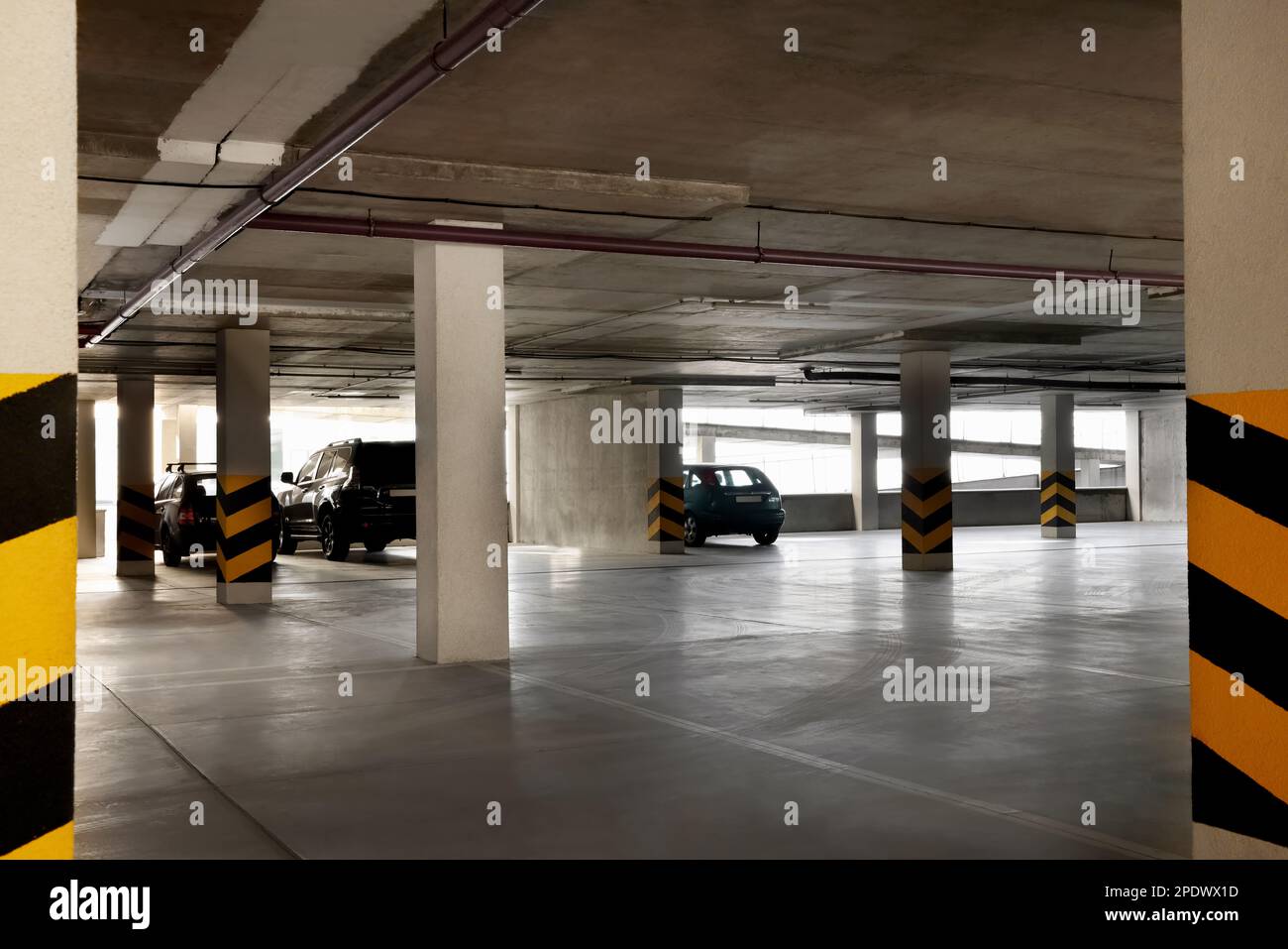 Open parking garage with cars on sunny day Stock Photo - Alamy