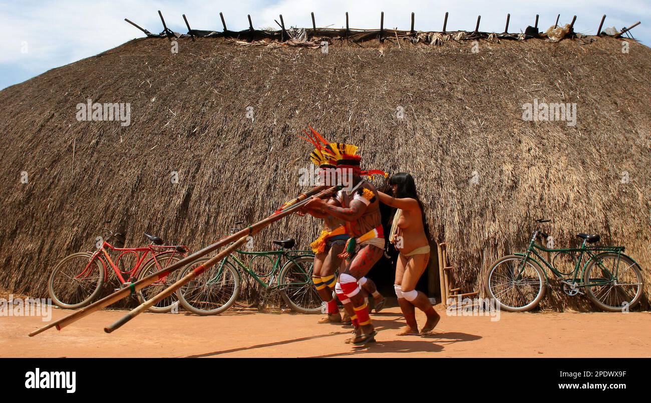 **ED NOTE PARTIAL NUDITY** Kuikuro Indians play the 'Urua' flute and ...