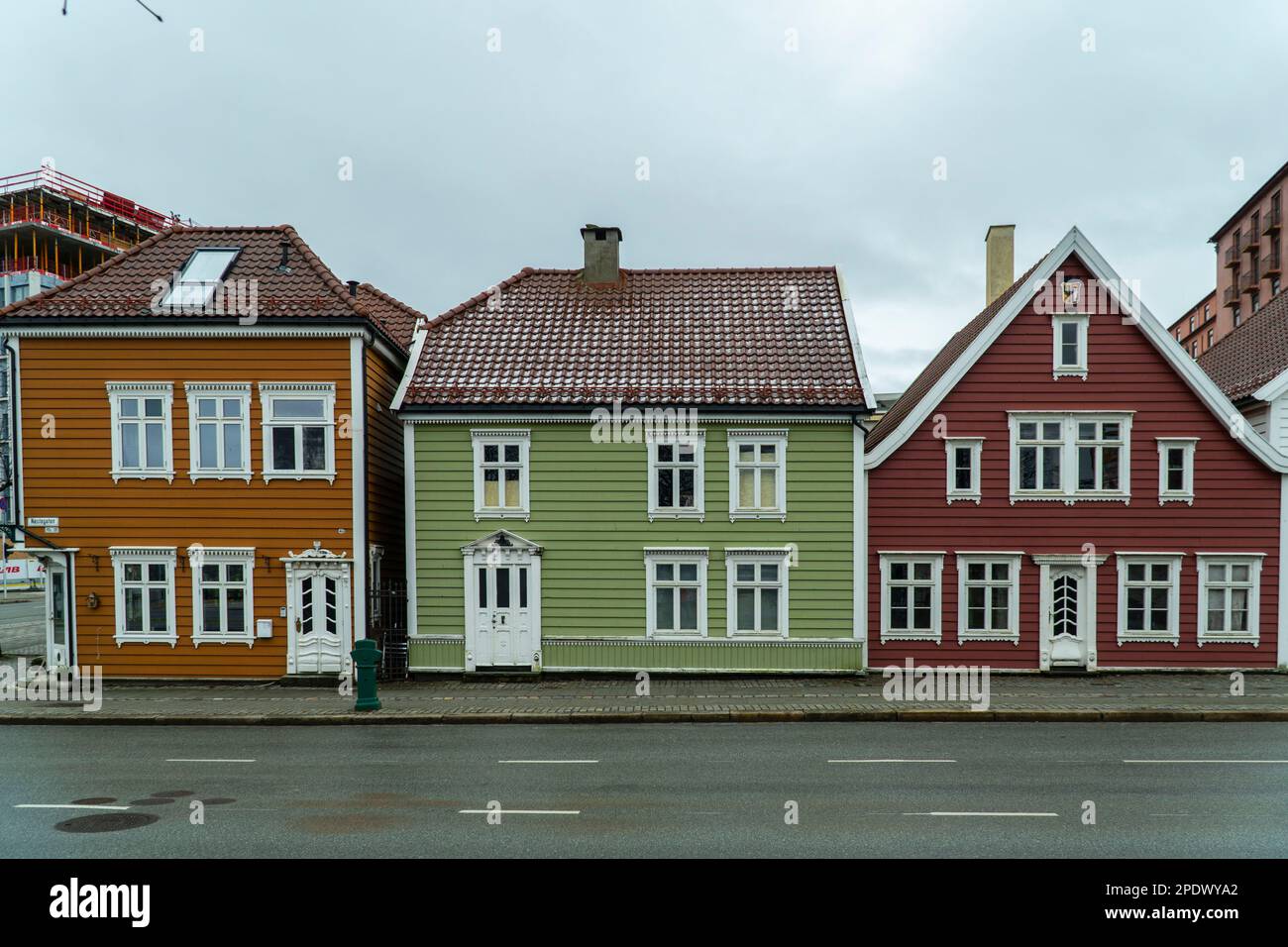 An idyllic scene featuring a row of colorful wooden buildings with ...