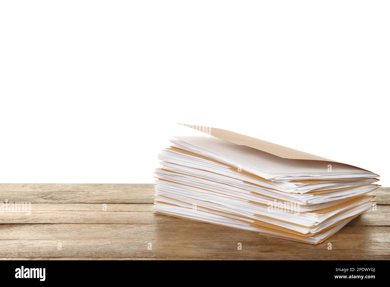 Stack of yellow files with documents on wooden table against white ...