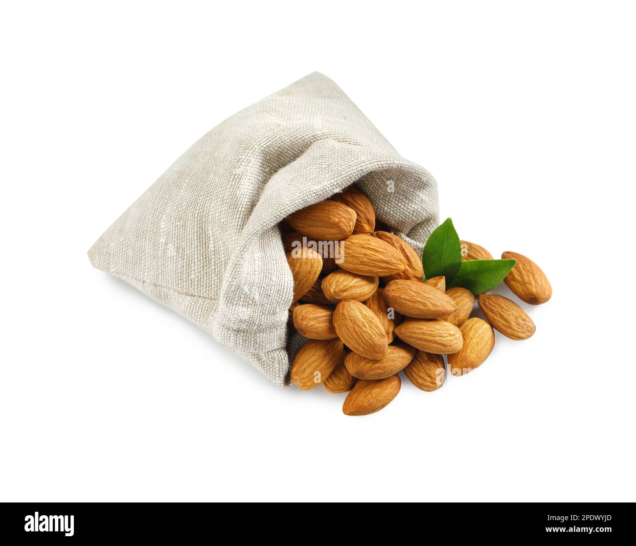 Sack with organic almond nuts and green leaves on white background ...