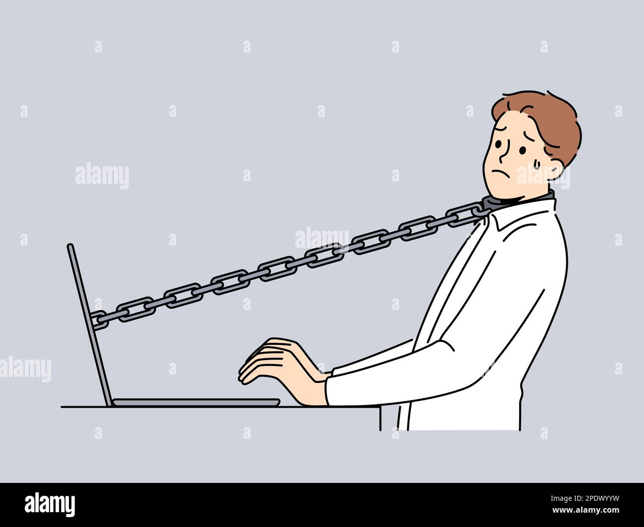 Stressed male employee tied with chain to computer in office. Unhappy ...