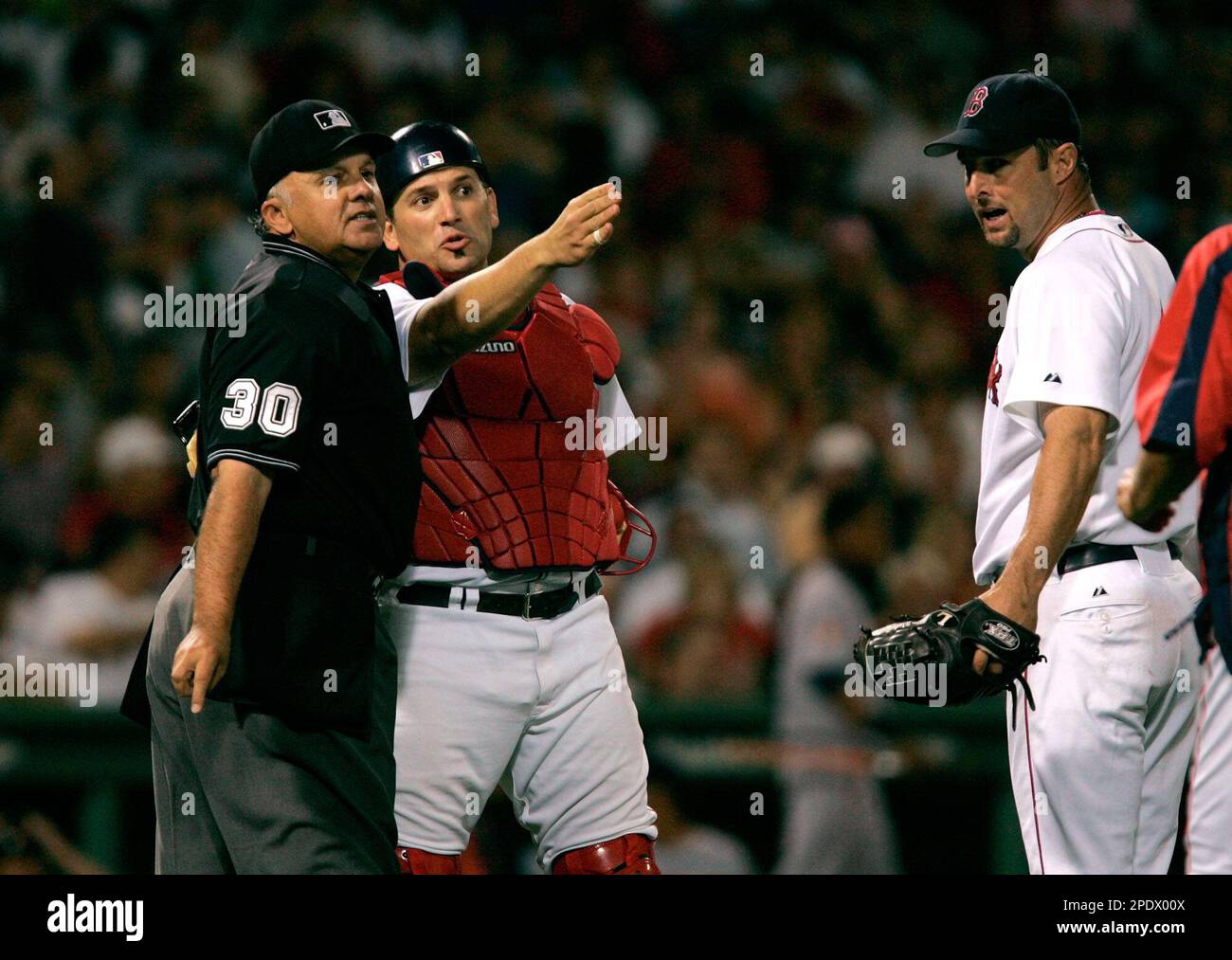 Boston Red Sox catcher Doug Mirabelli, center, points out the first ...