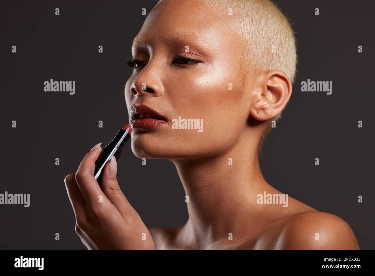 Beauty, makeup and face of woman with lipstick in studio for cosmetics ...