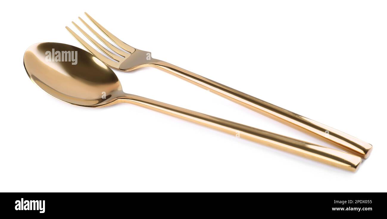 New shiny golden fork and spoon on white background Stock Photo - Alamy