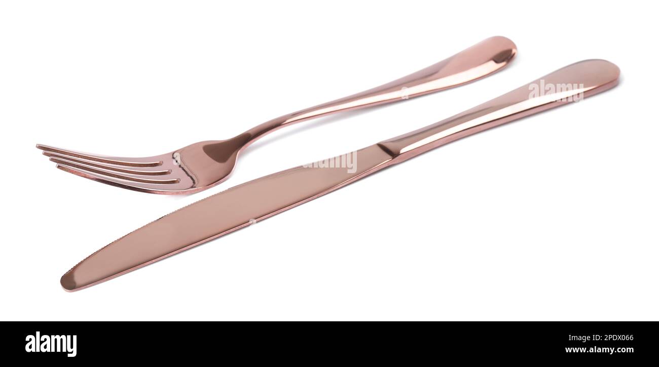 New shiny fork and knife on white background Stock Photo - Alamy