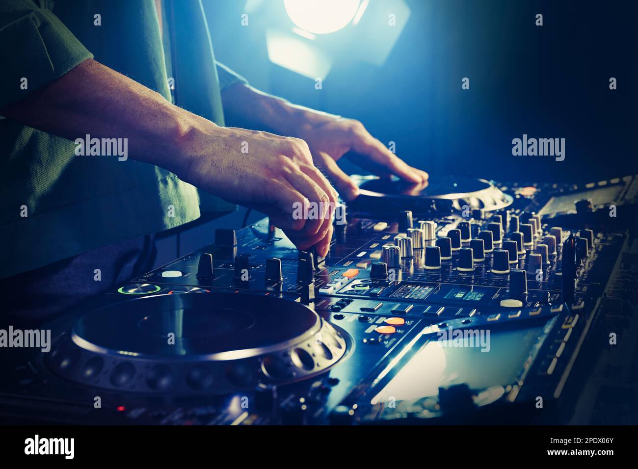 DJ creating music on modern console mixer in night club, closeup Stock ...