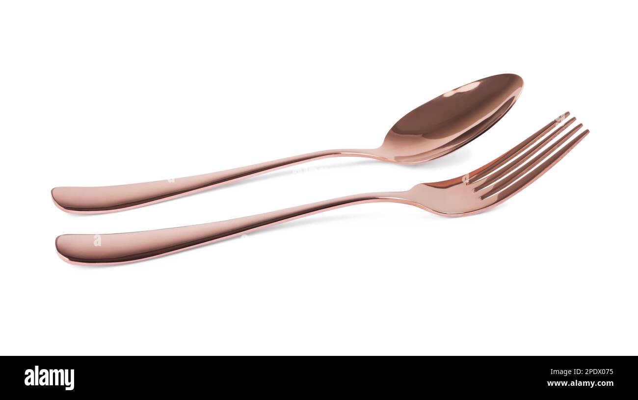 New shiny fork and spoon on white background Stock Photo - Alamy