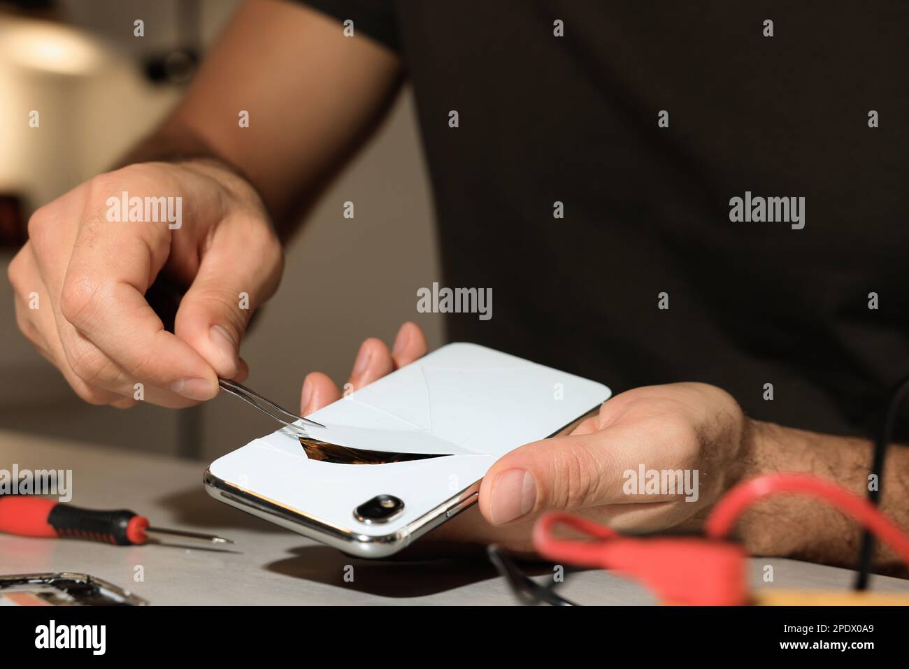 Technician repairing broken smartphone hi-res stock photography and ...