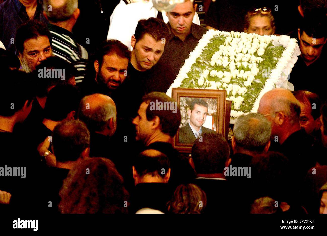 Relatives of flight attendant Andreas Prodromou, killed in the Aug. 14 ...