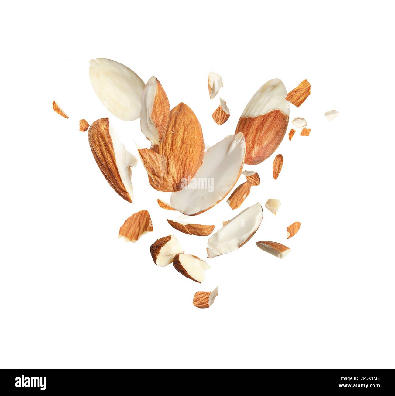 Pieces of tasty almonds falling on white background Stock Photo - Alamy