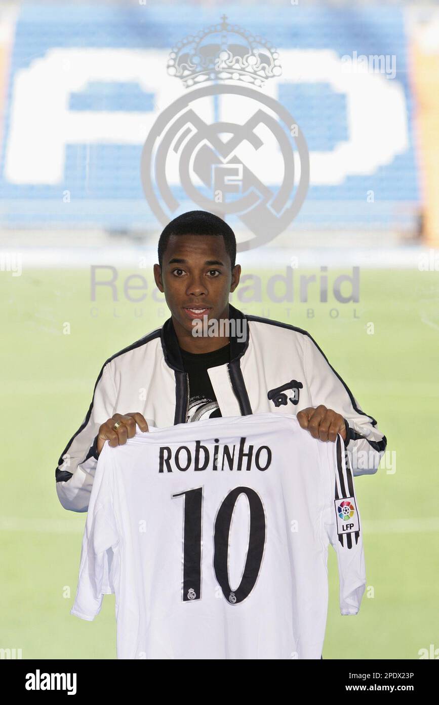 Brazilian soccer player Robinho shows his shirt during the official ...