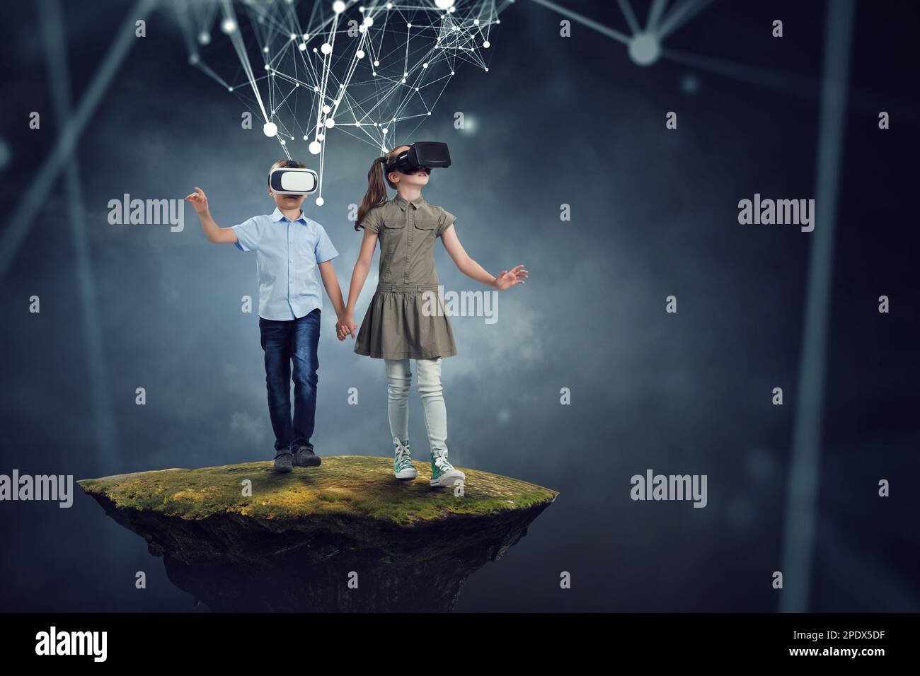 Kids wearing virtual reality goggles Stock Photo - Alamy