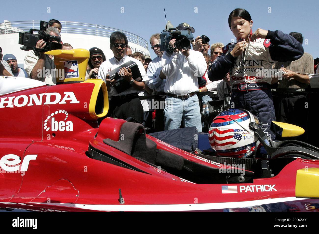 Danica Patrick, right, is surrounded by media as she prepares for the ...