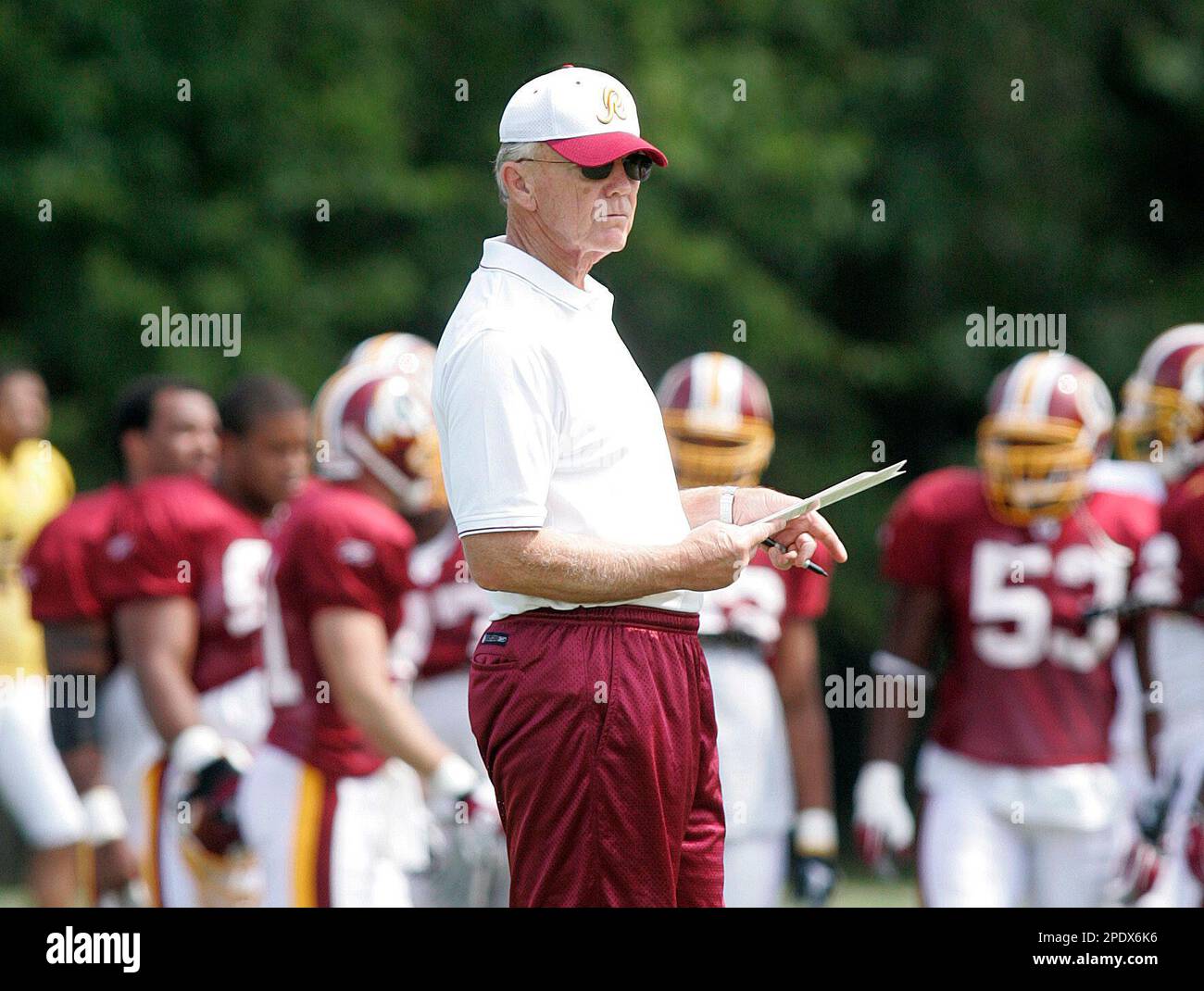 Redskins coach, Joe Gibbs is shown at the start of afternoon practice ...