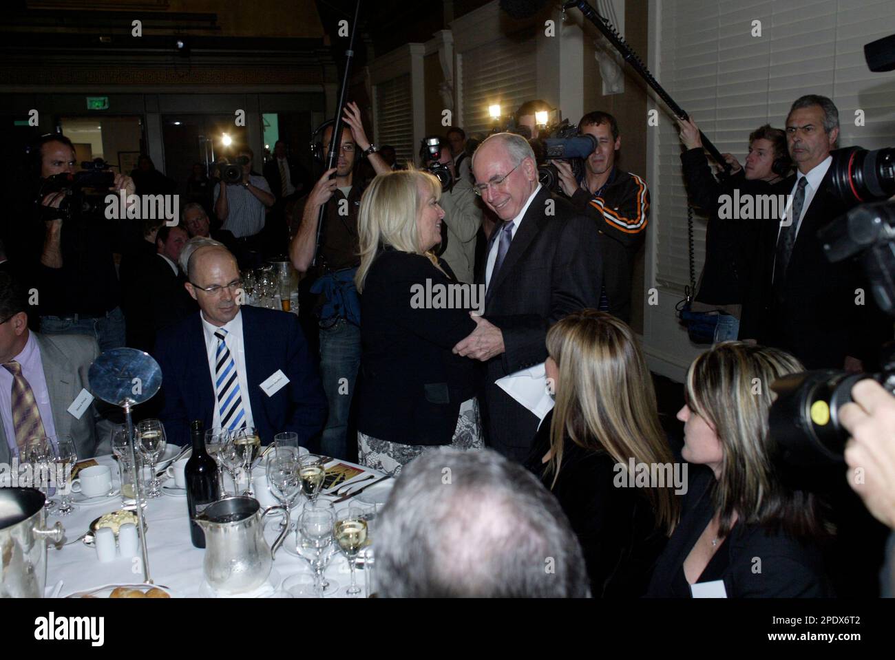Australian Prime Minister John Howard embraces Marcella Zemanek, widow ...