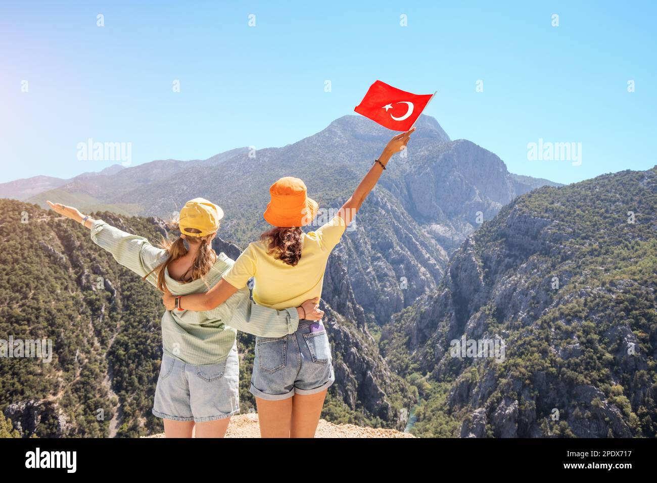 two girls friends take in the stunning mountain scenery together in ...